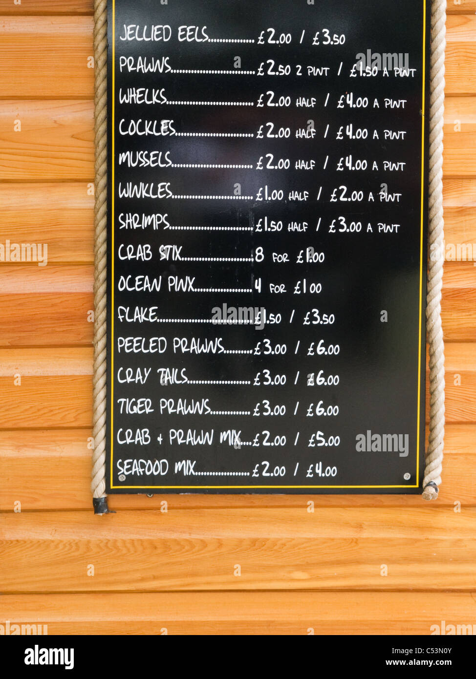 Seaside shellfish menu price board Stock Photo - Alamy