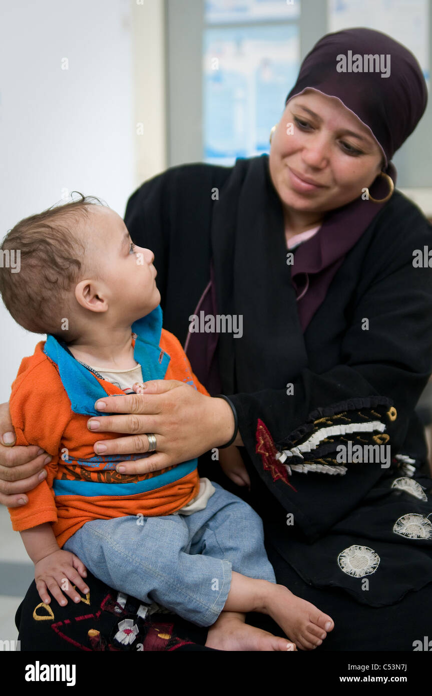 EGYPT, FAYOUM: Heba Abdel Zaher attends with her son to an antenatal in ...