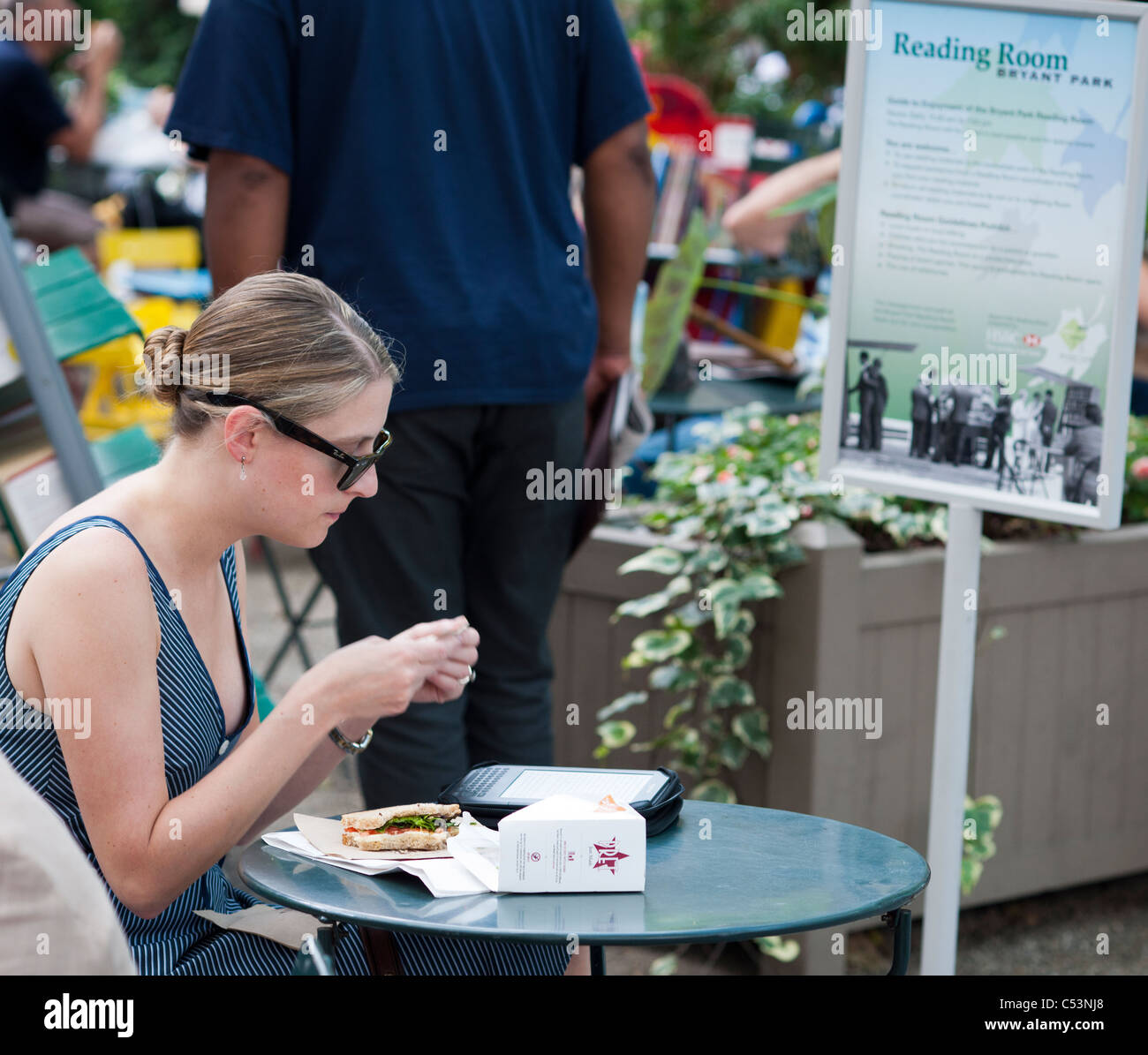 A reader uses her Amazon Kindle ereader in Bryant Park in New York on ...