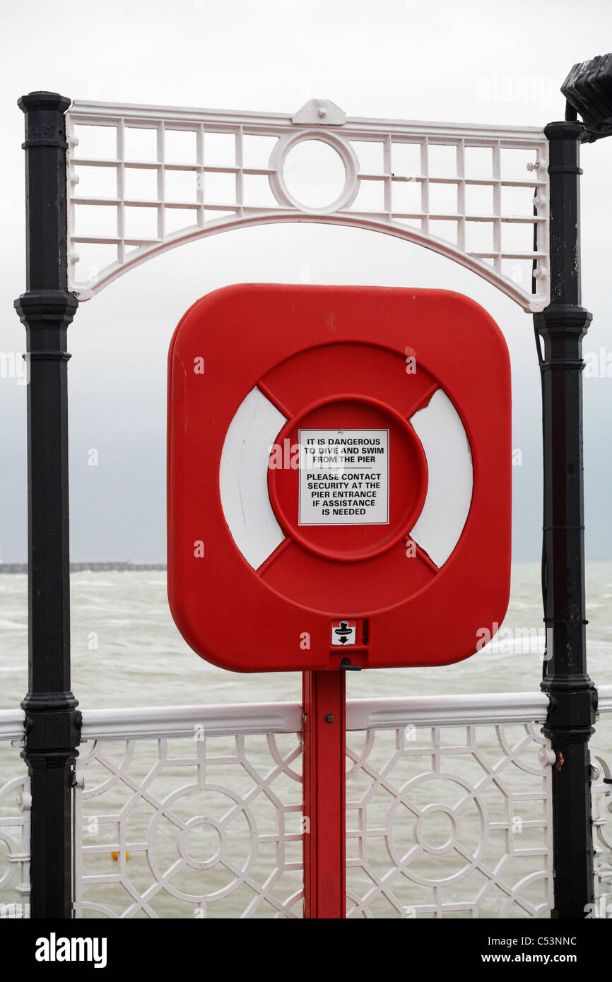 Warning signs on Brighton Pier in May Stock Photo - Alamy