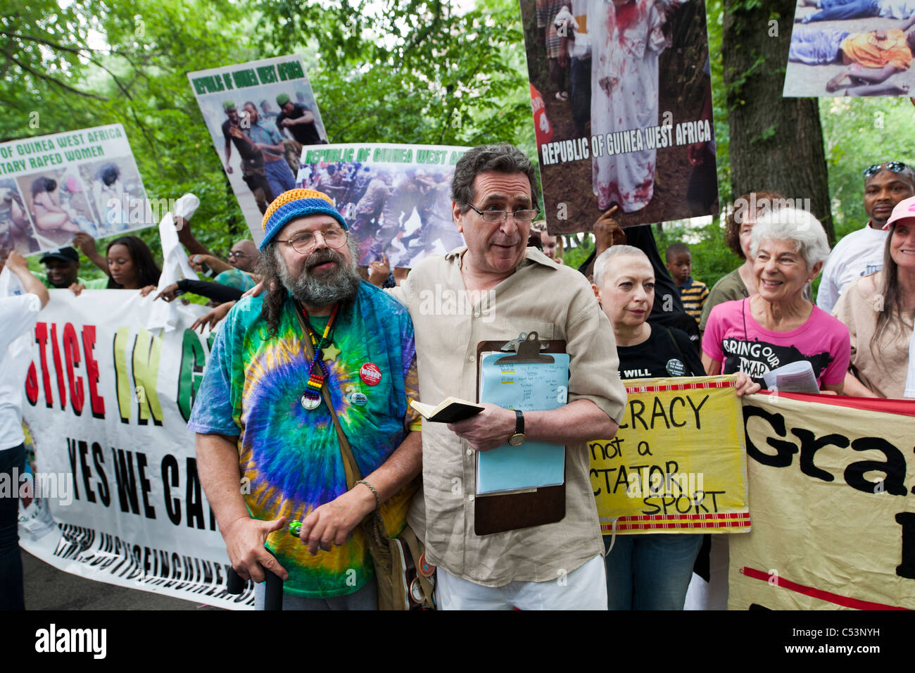 Norman Siegel, right, hugs Hippie Pie-Man Aaron Kaye after reading ...