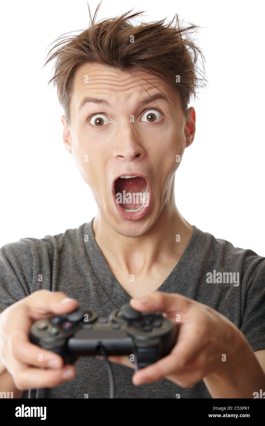 Young crazy man plays computer game with joystick Stock Photo - Alamy