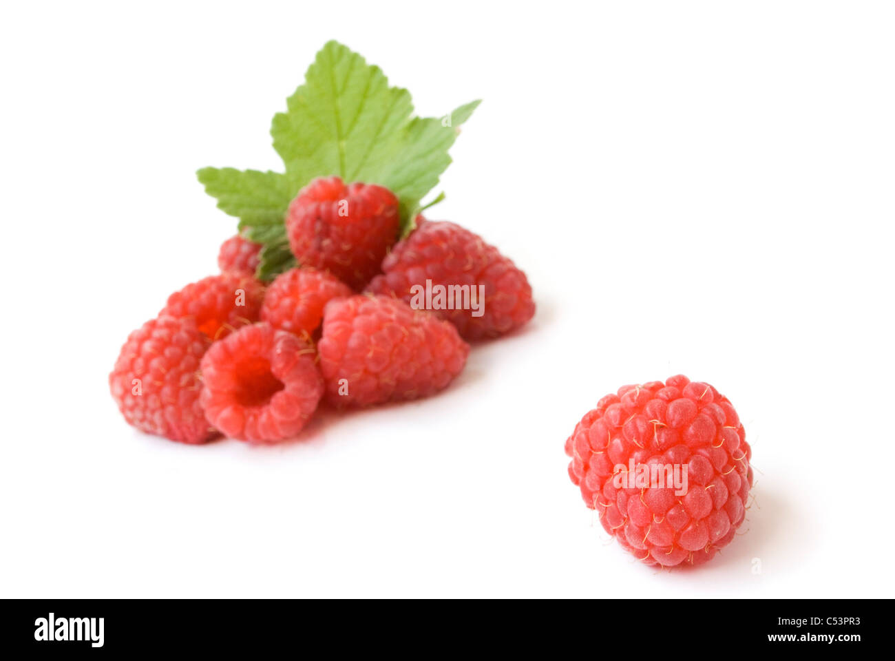 ripe red raspberries isolated on white background Stock Photo - Alamy