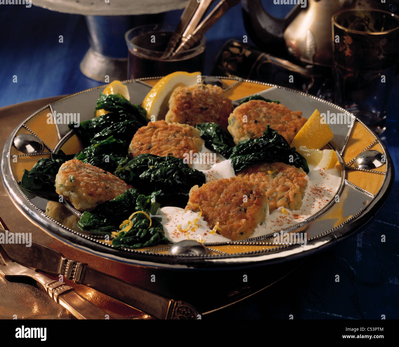 Rice dumplings with spinach and yogurt sauce Stock Photo - Alamy