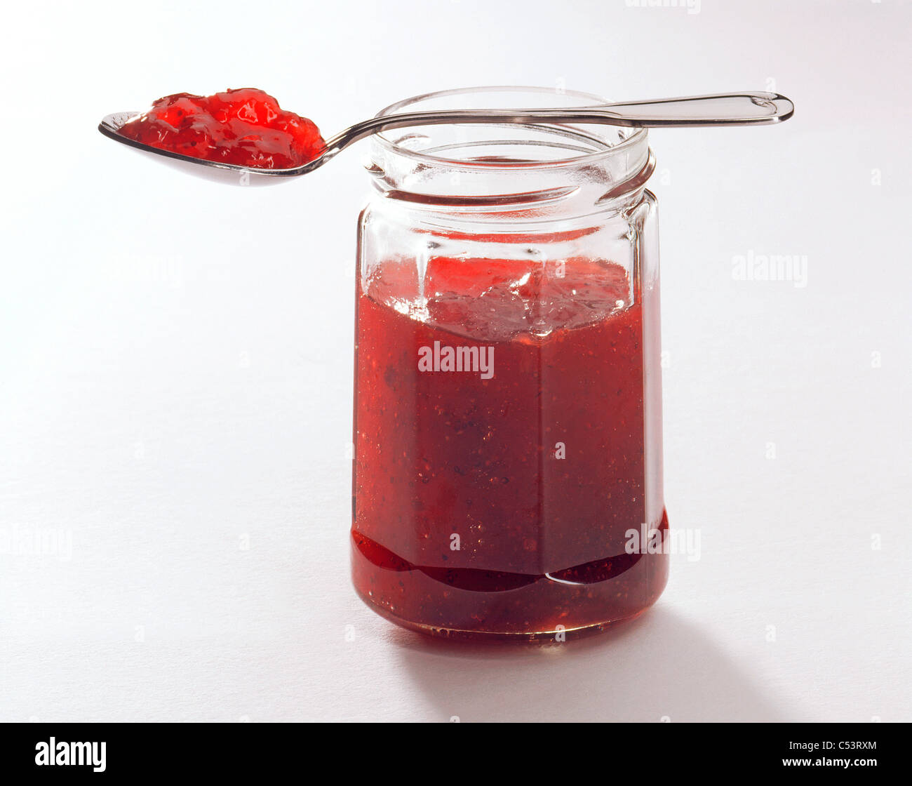 Cut out: Glass of yam with spoon, strawberry - jam Stock Photo - Alamy