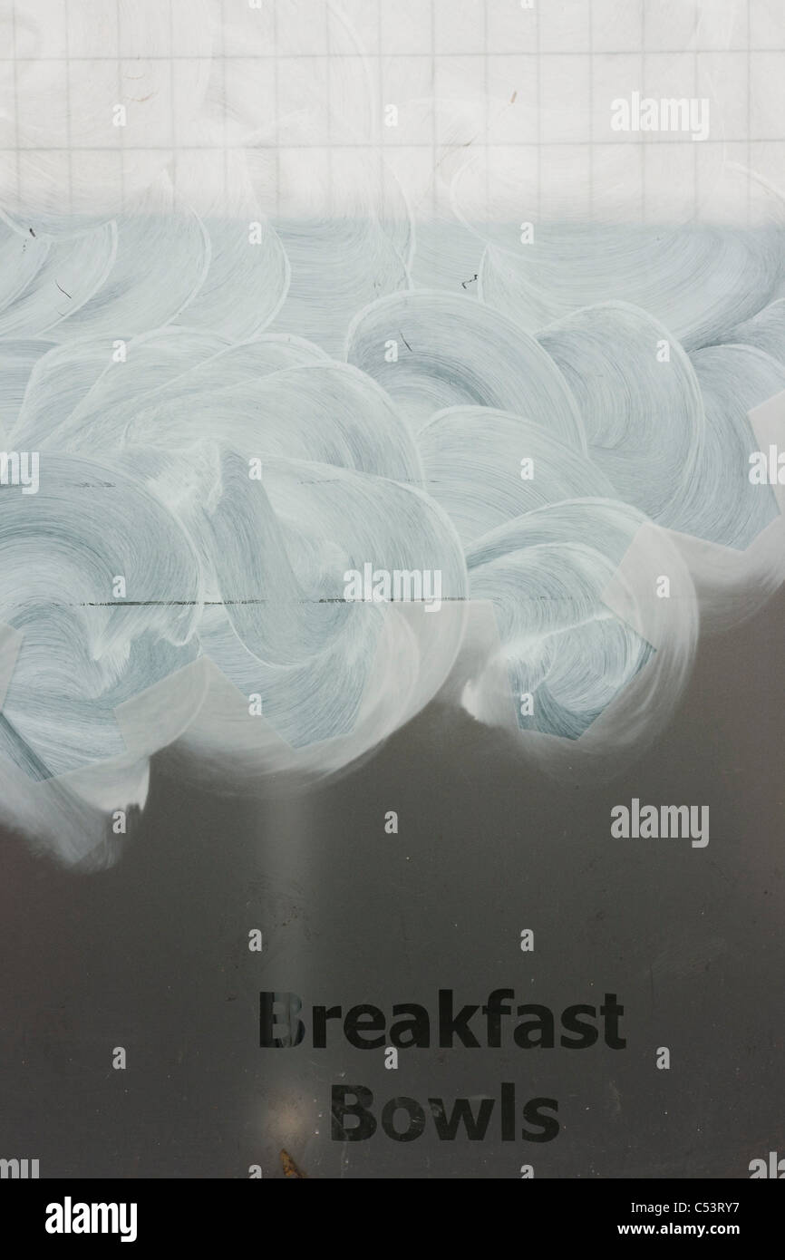 The stenciled words 'breakfast bowls' have been left on a lunchtime ...