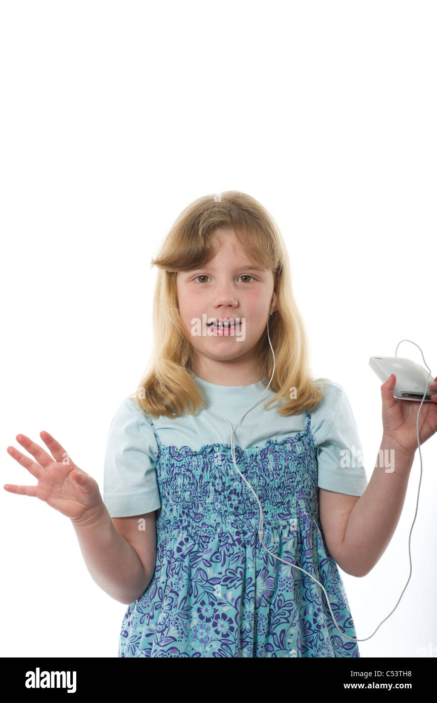 Young girl smiling and looking nicely surprised while holding a iphone ...