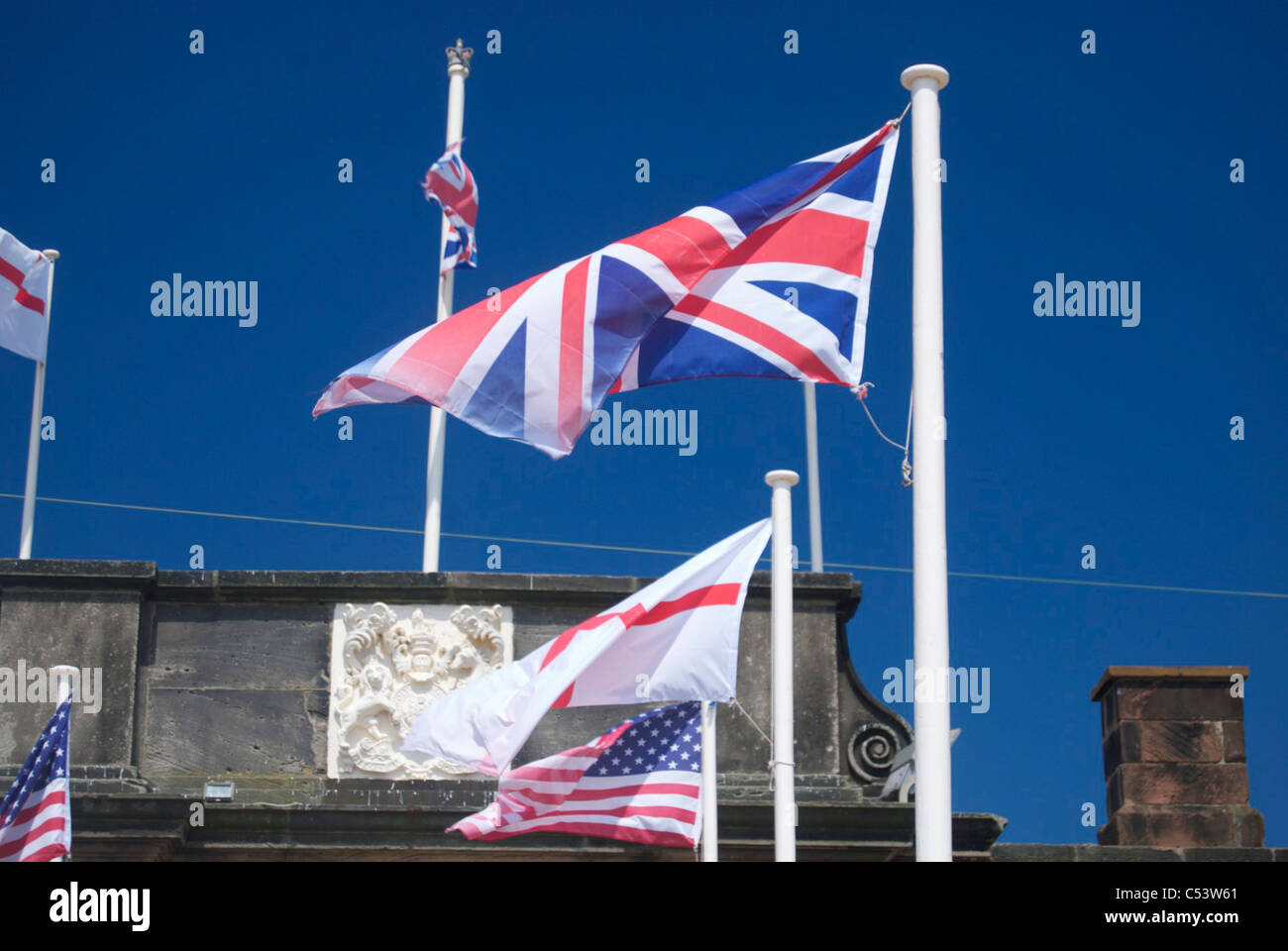 Flags blowing in the breeze Stock Photo - Alamy