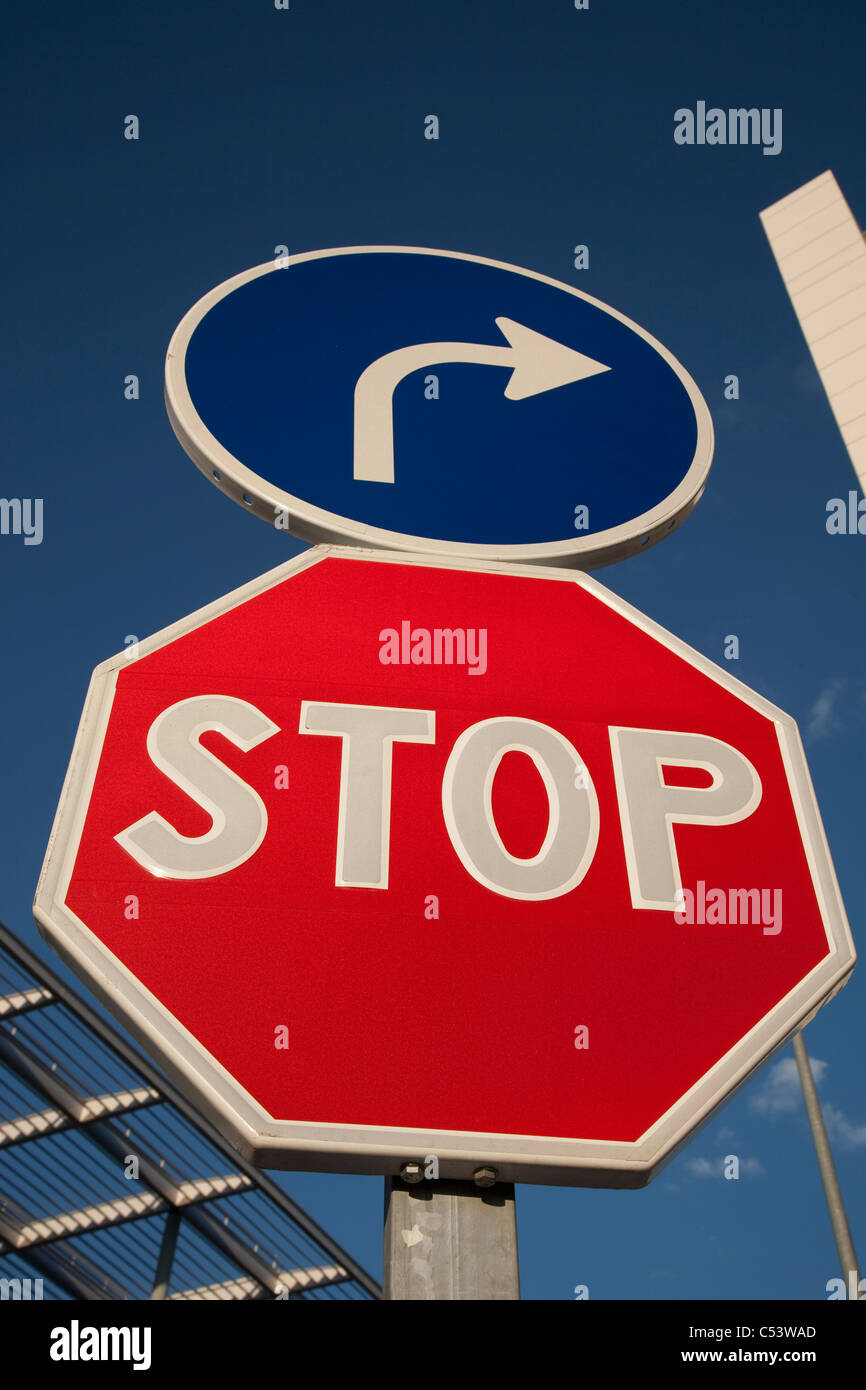 Close-up of two traffic signs in urban setting Stock Photo - Alamy