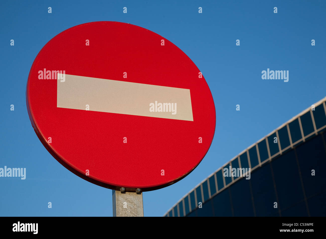 Red no entry sign with modern office detail in the background Stock ...