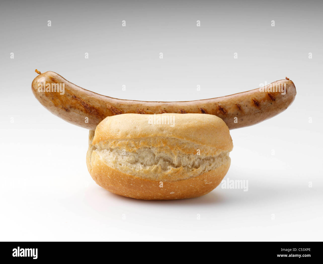 Bratwurst in a roll on a neutral background Stock Photo - Alamy