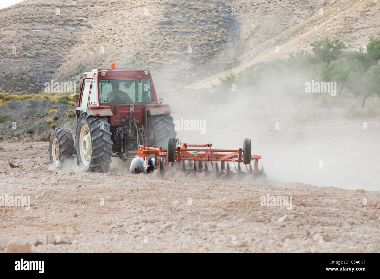 A farmer tilling dry dusty soil near Lorca, Murcia, Spain Stock Photo ...