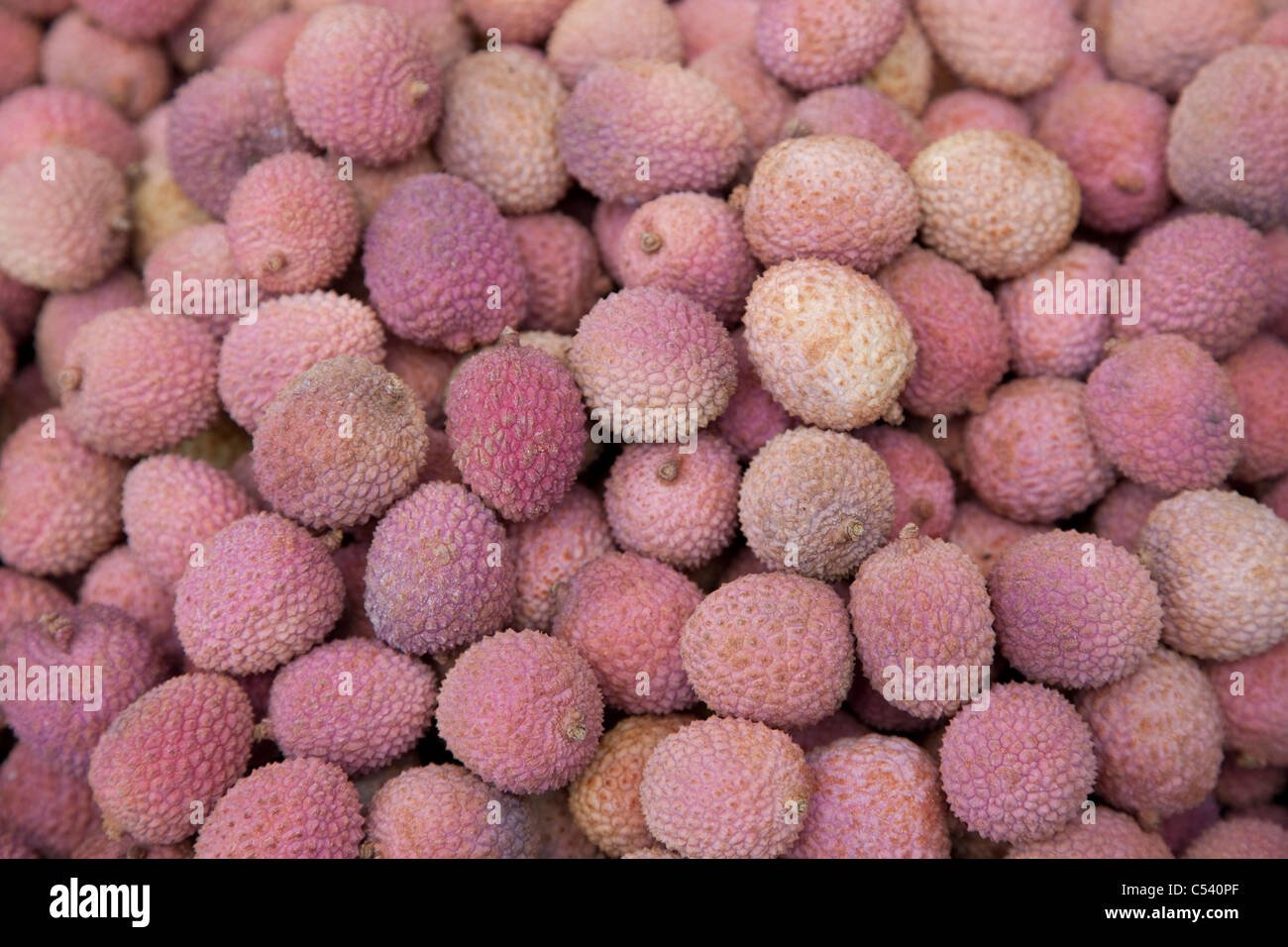 Lychee for sale on market stall Stock Photo - Alamy