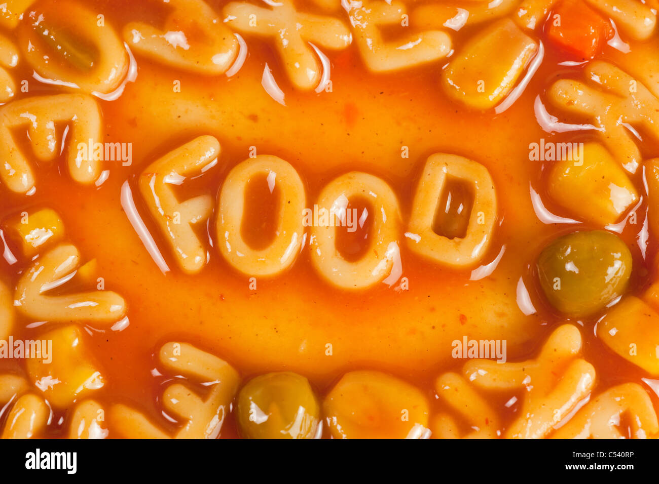 Alphabet shaped pasta forming the word FOOD in tomato sauce Stock Photo ...