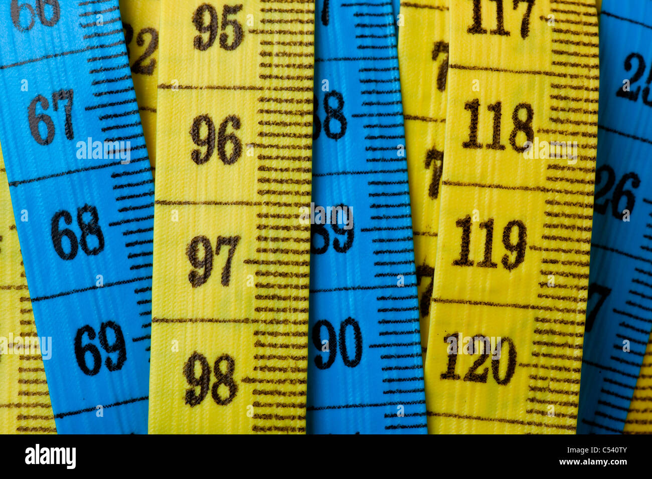 Closeup of the numbers on colorful measuring tapes Stock Photo - Alamy