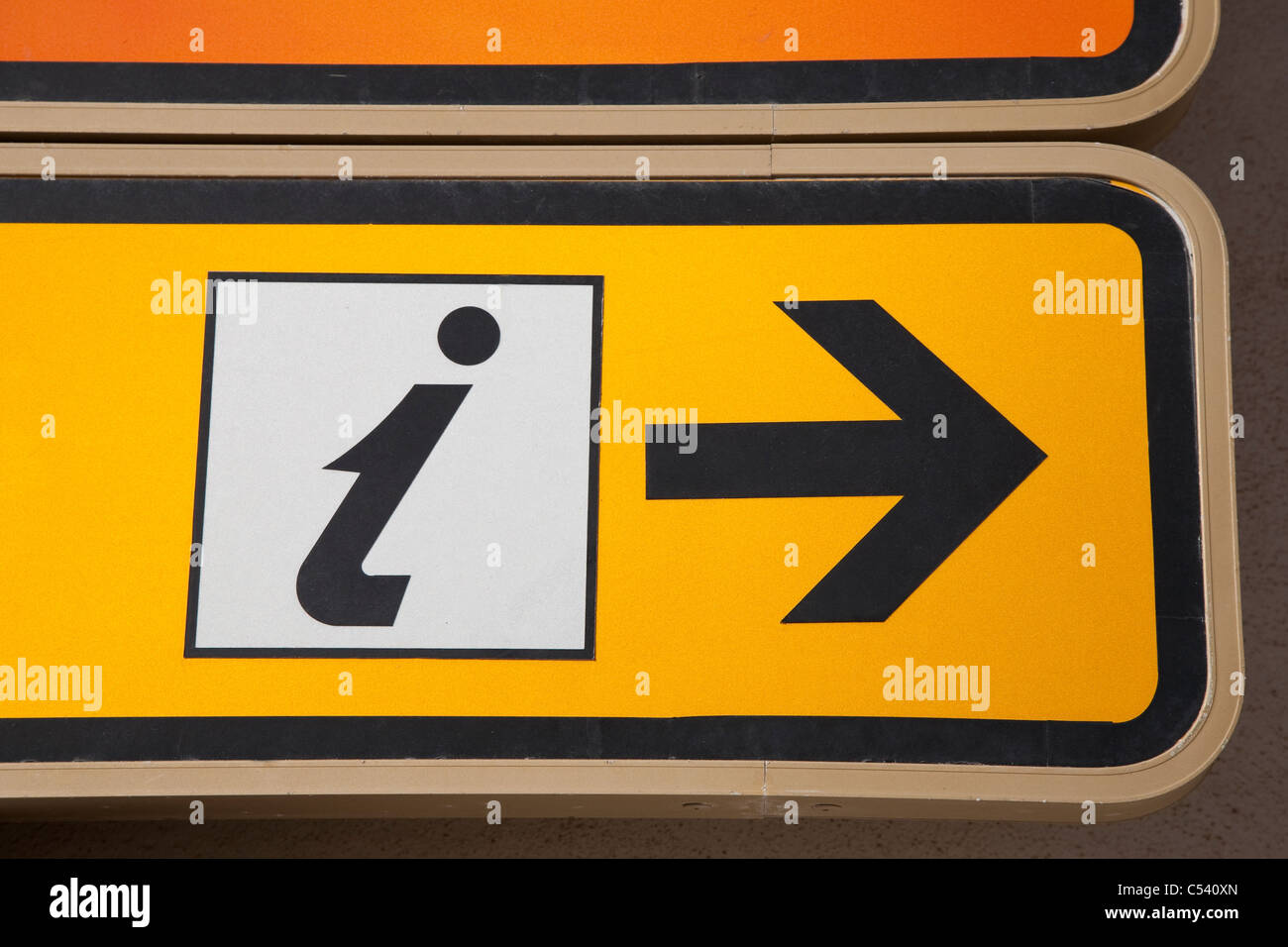 Close-up of Yellow Information Sign with Arrow Stock Photo - Alamy