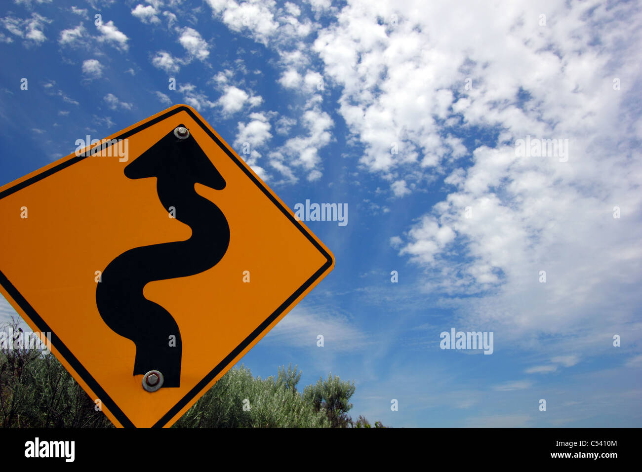 ROAD WARNING SIGN WOBBLY ARROW WARNING SKY BACKGROUND BDB Stock Photo ...