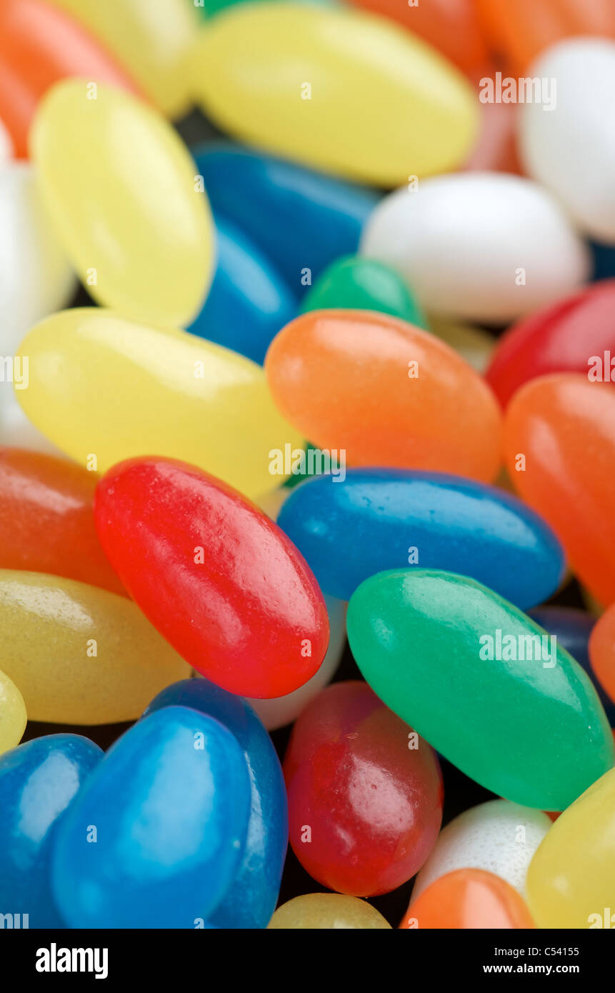 group of pill shaped candies and assorted colors Stock Photo - Alamy