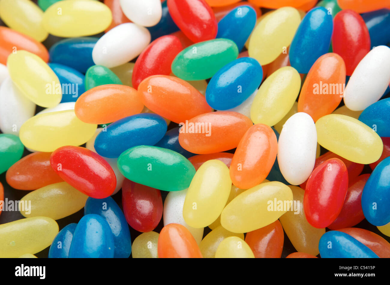 group of pill shaped candies and assorted colors Stock Photo - Alamy