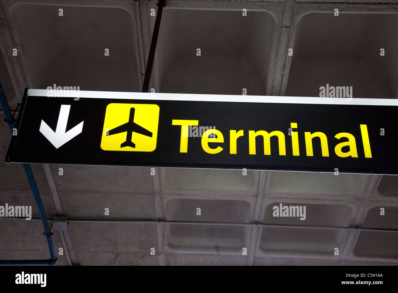 Illuminated Yellow Airport Terminal Sign Stock Photo - Alamy