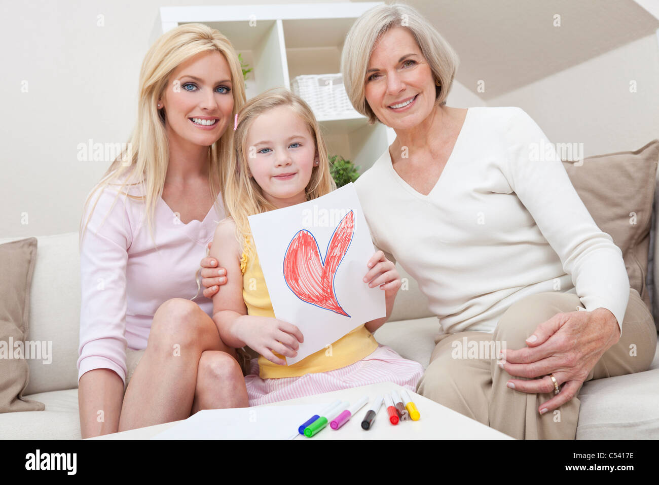 Three female generations of one family at home. Mother, grandmother and ...