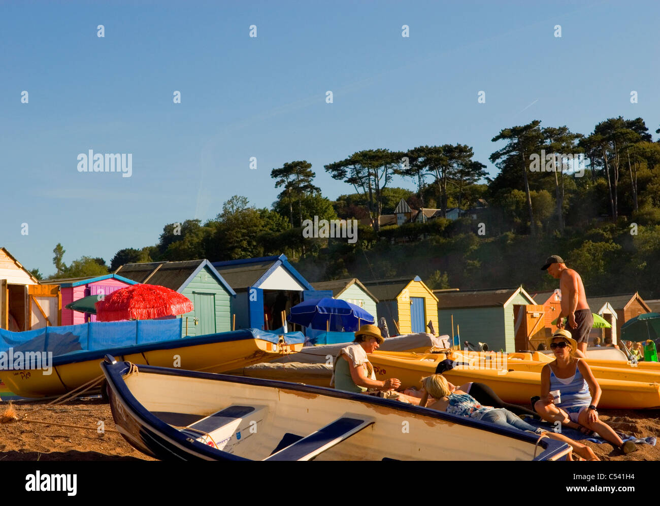 Colourful beach huts and boats Stock Photo - Alamy