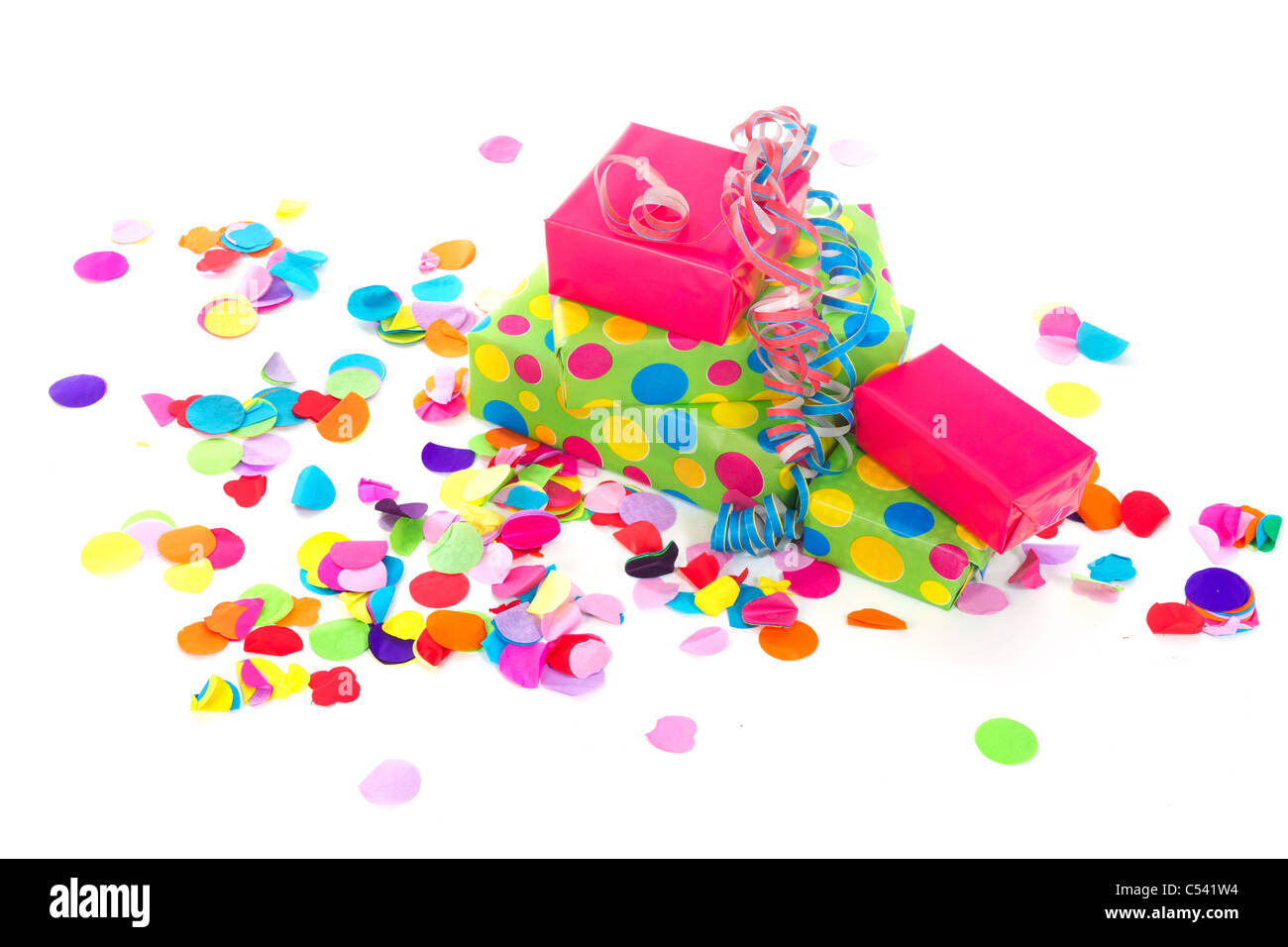 Wrapped birthday presents with colorful paper confetti Stock Photo - Alamy