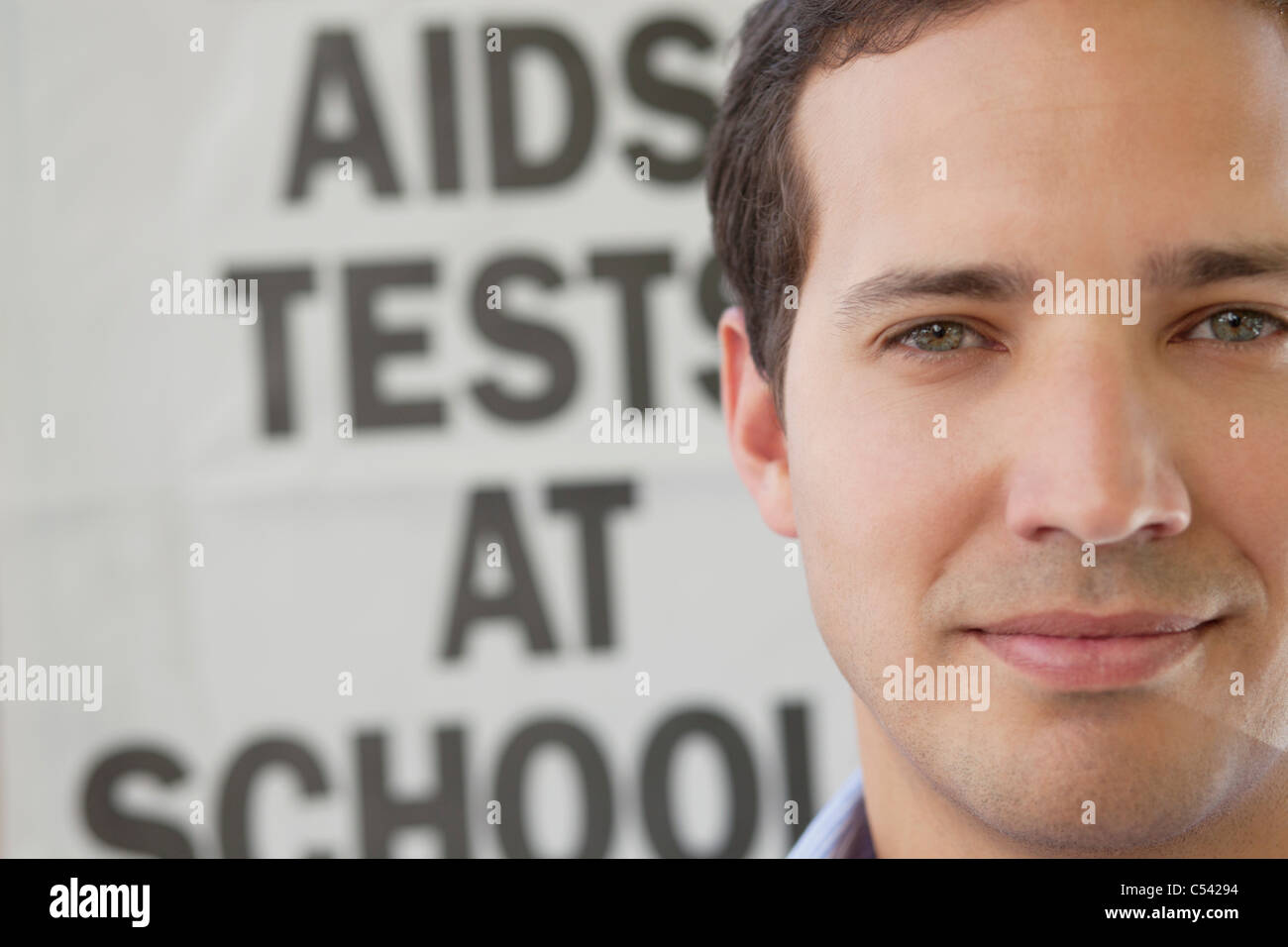 Close-up of a man in front of AIDS awareness poster Stock Photo - Alamy