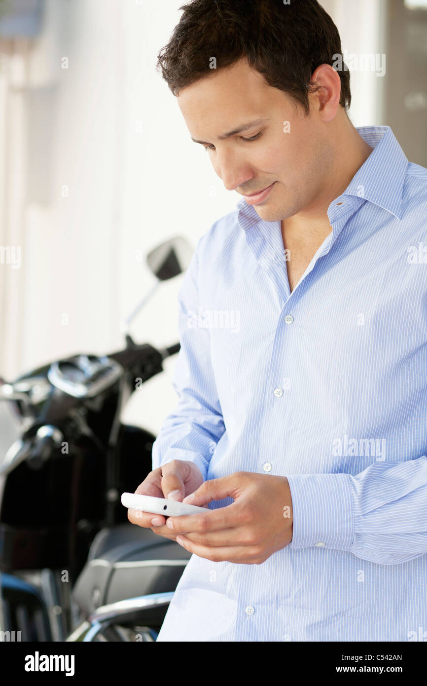 Man text messaging on a mobile phone Stock Photo - Alamy