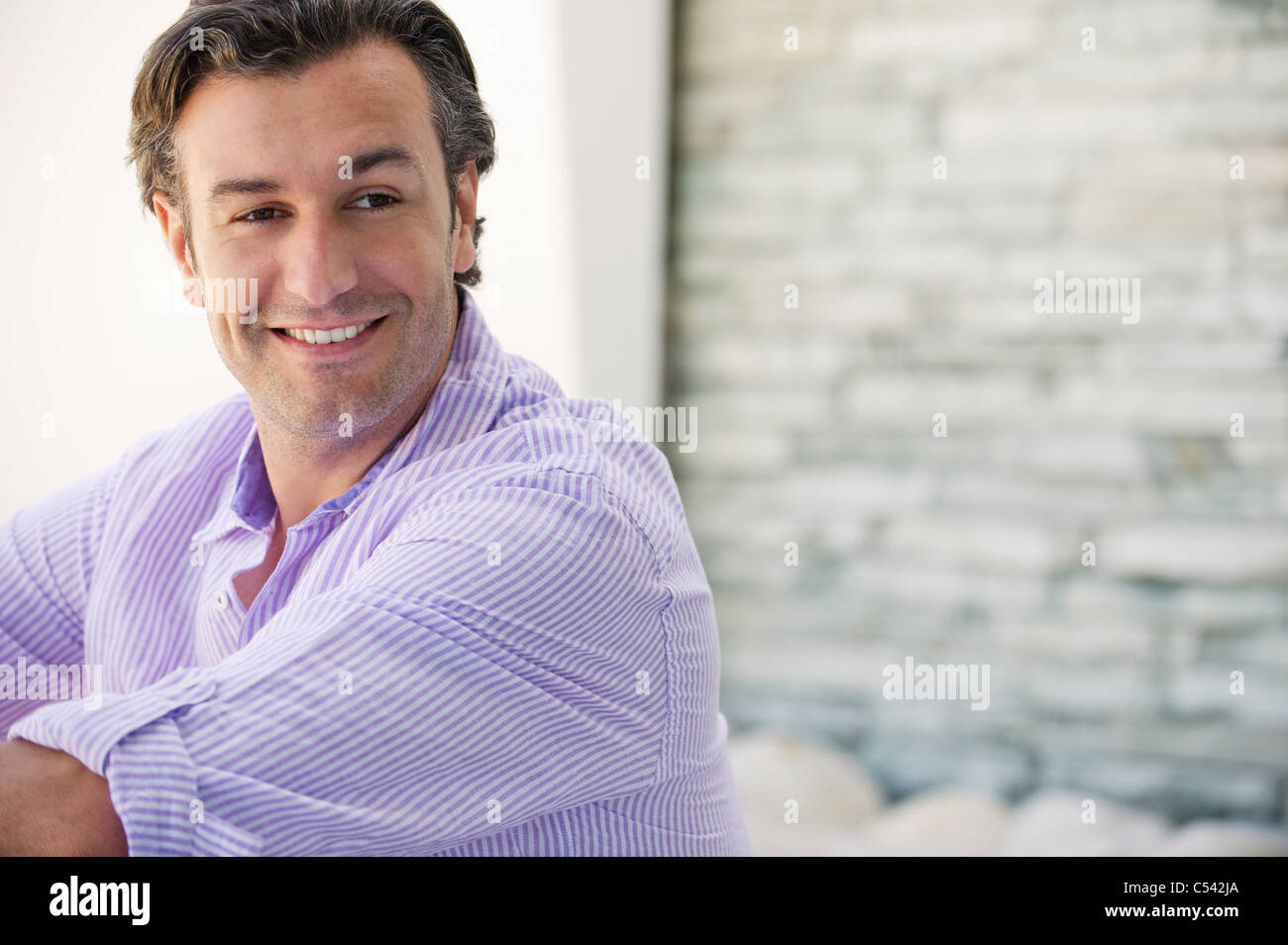Close-up of a mid adult man smiling Stock Photo - Alamy