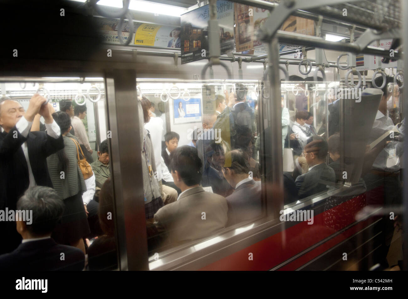 Passengers traveling in a subway train, Tokyo, Japan Stock Photo - Alamy