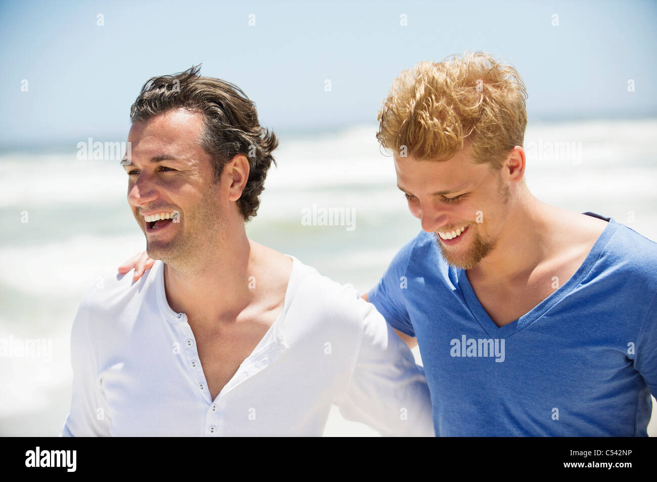 Two men laughing together Stock Photo - Alamy
