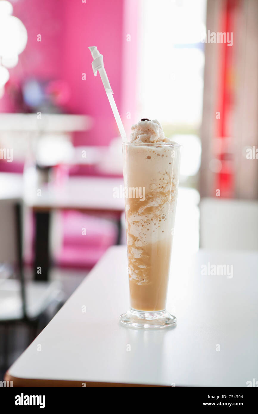 Chocolate milkshake placed on a table in a restaurant Stock Photo - Alamy