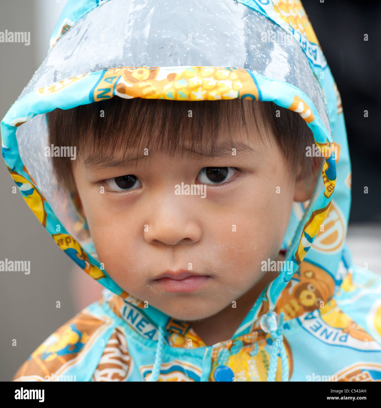 Close-up of a boy in raincoat, Tokyo, Japan Stock Photo - Alamy