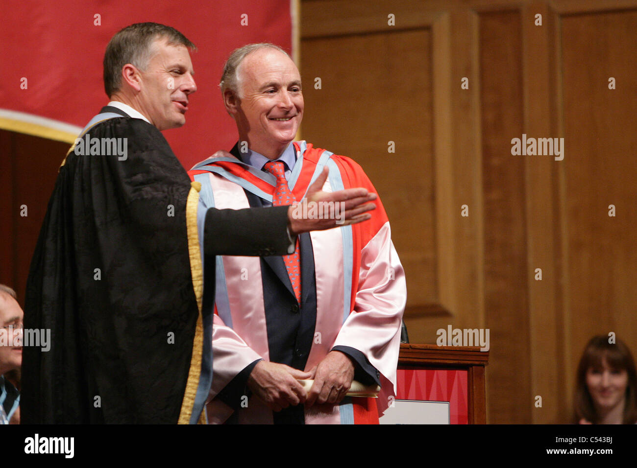 Receives an honorary doctorate for services to business and commerce hi ...