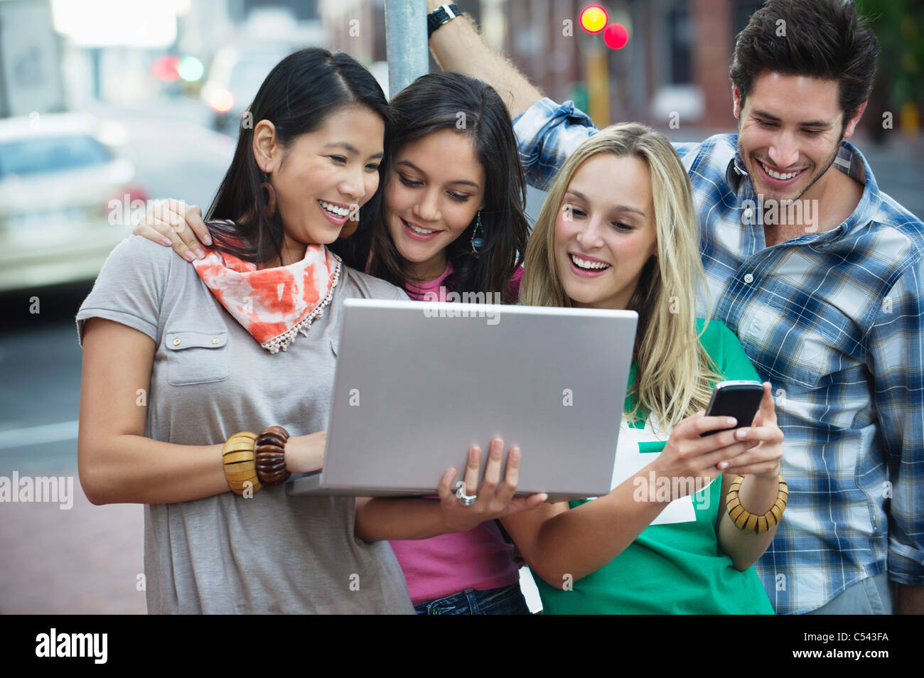 Friends using each phone on the car hi-res stock photography and images ...