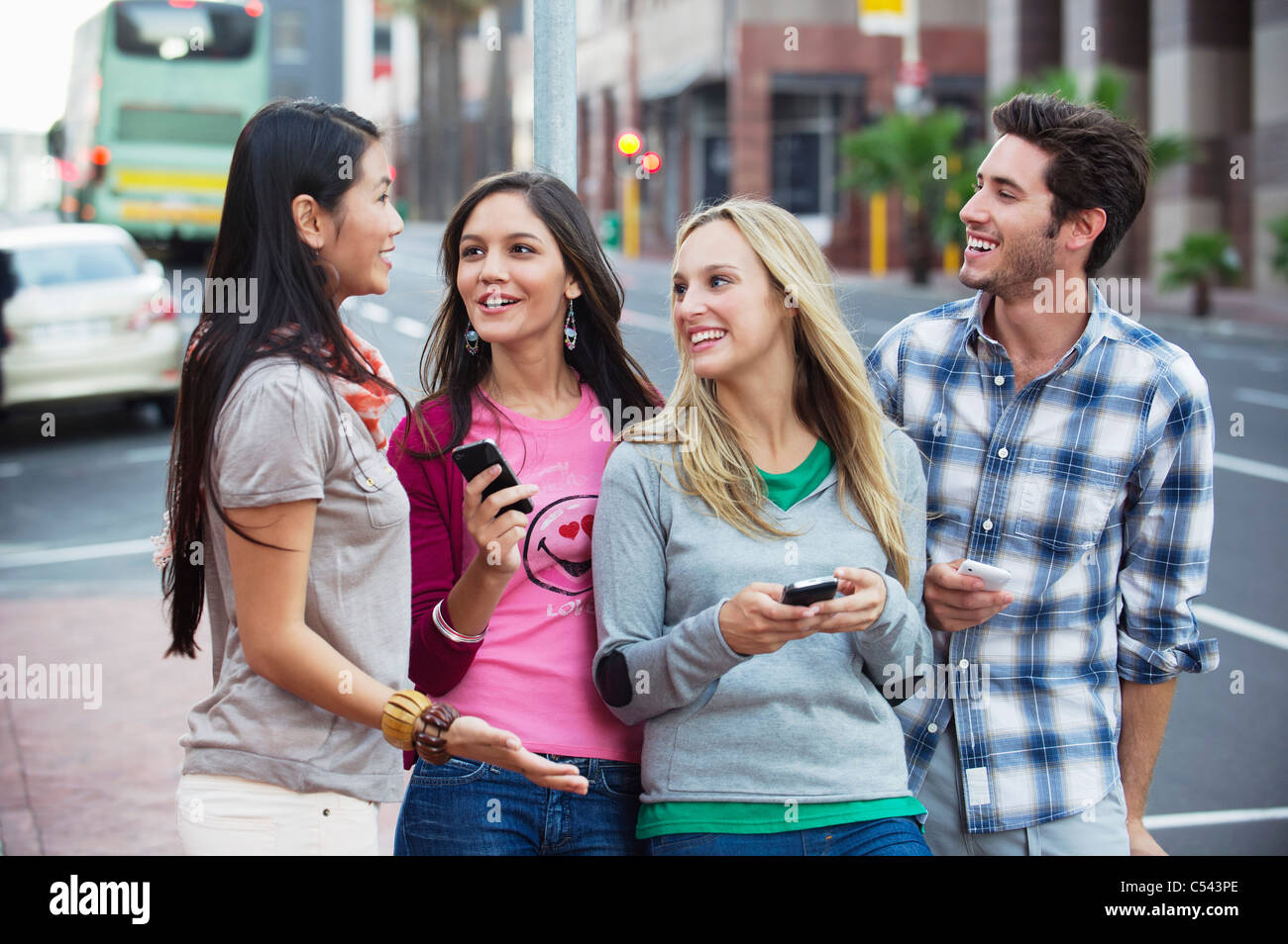 Friends using each phone on the car hi-res stock photography and images ...
