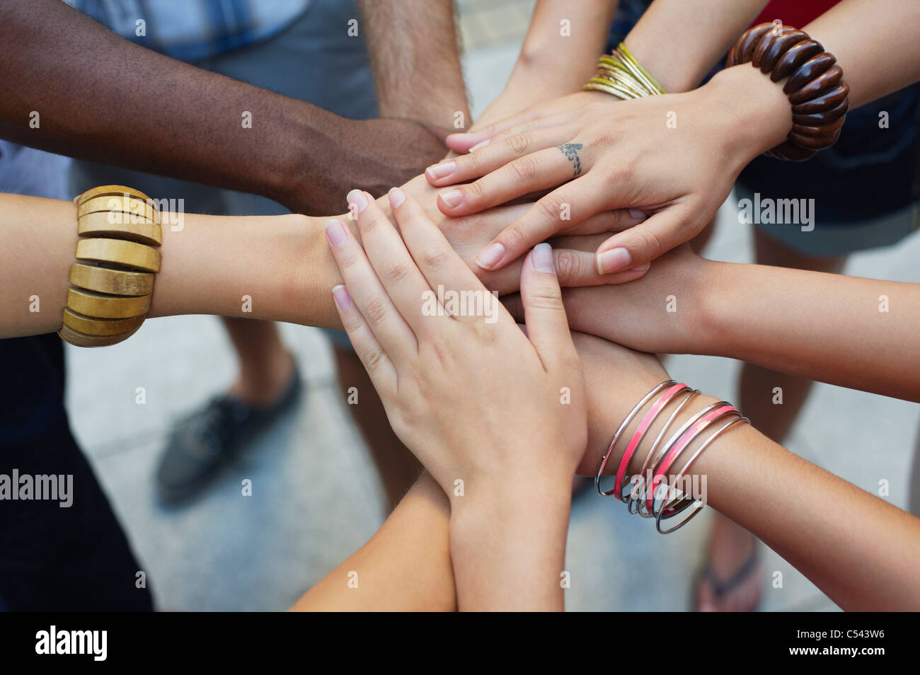Close-up of human hands stacked upon one another Stock Photo - Alamy