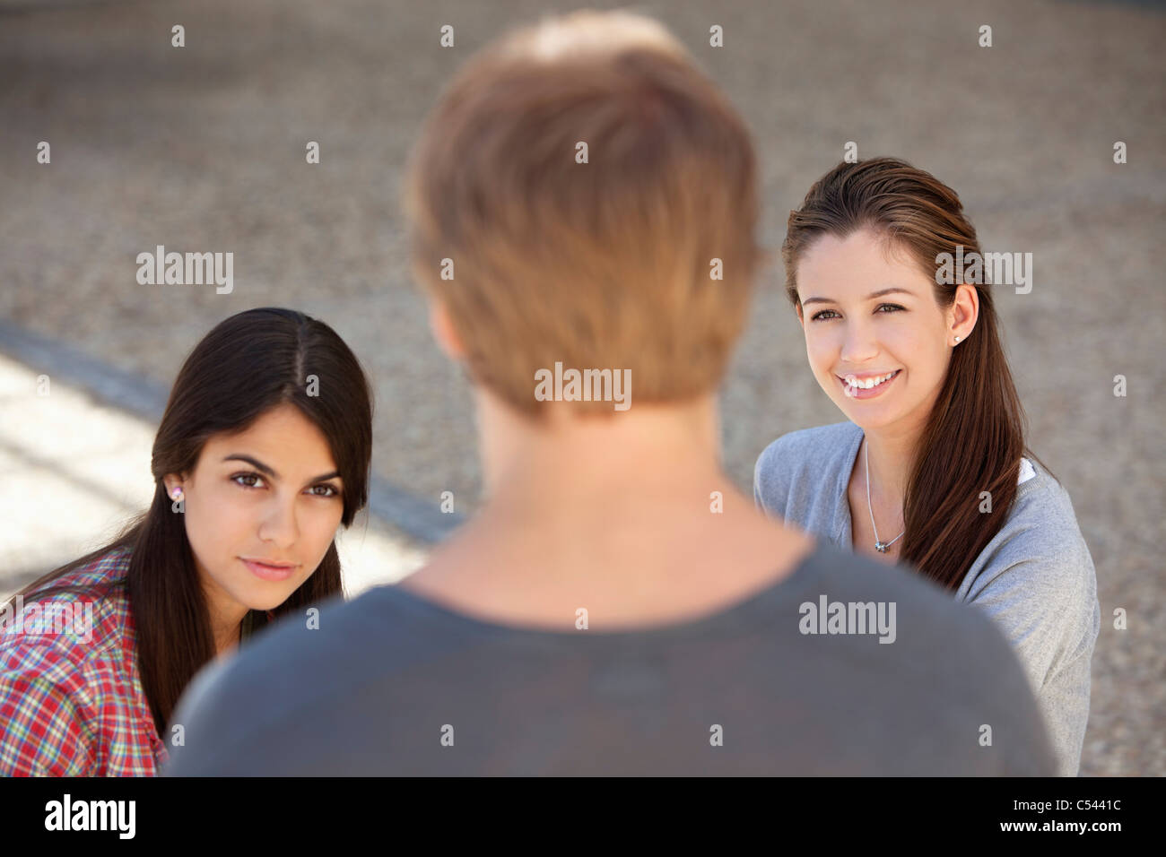 Three friends having discussion Stock Photo - Alamy