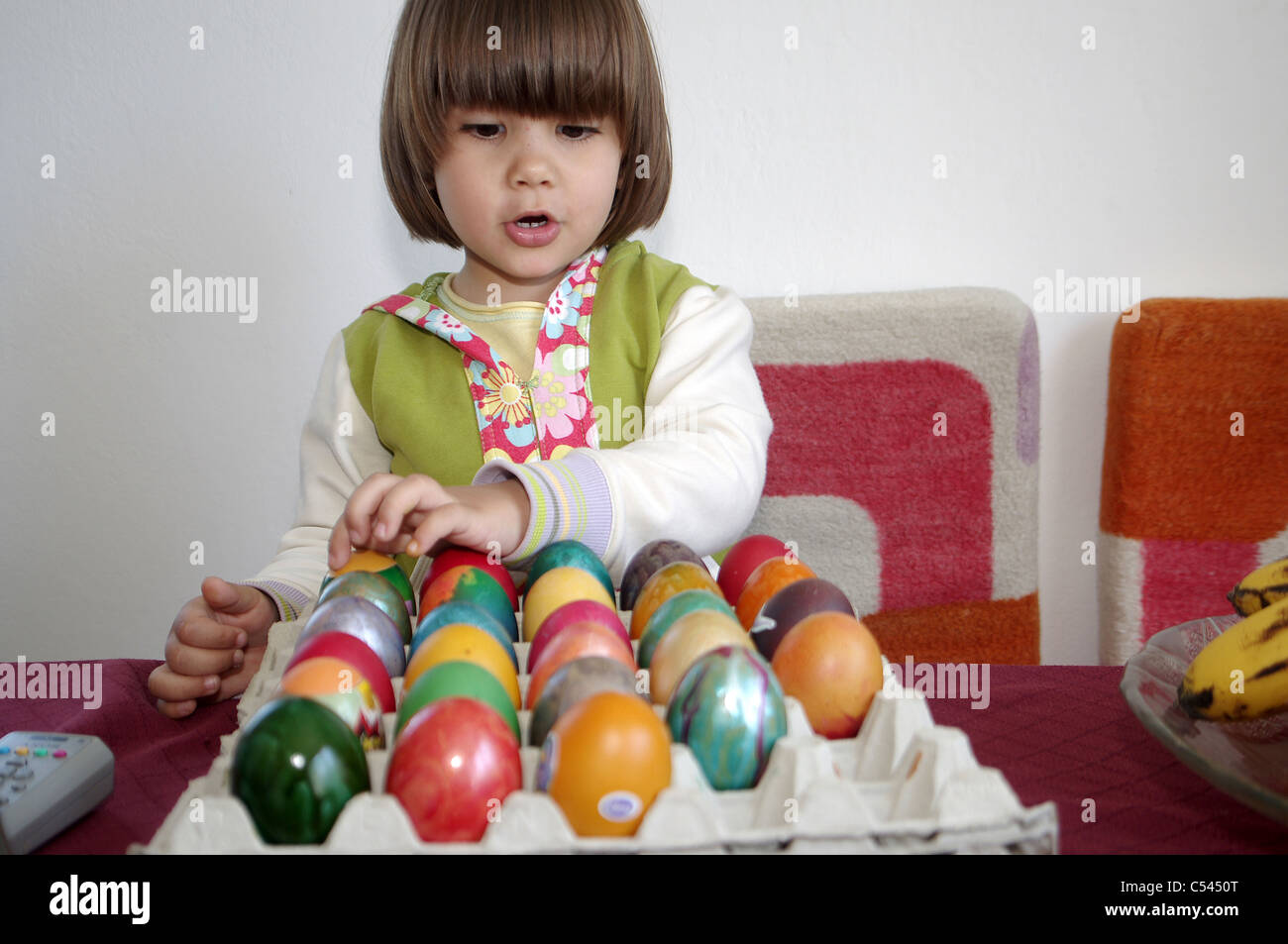 Child enjoy Easter eggs Stock Photo - Alamy