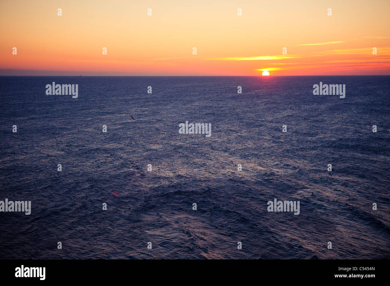 Water reflection of setting sun Stock Photo - Alamy