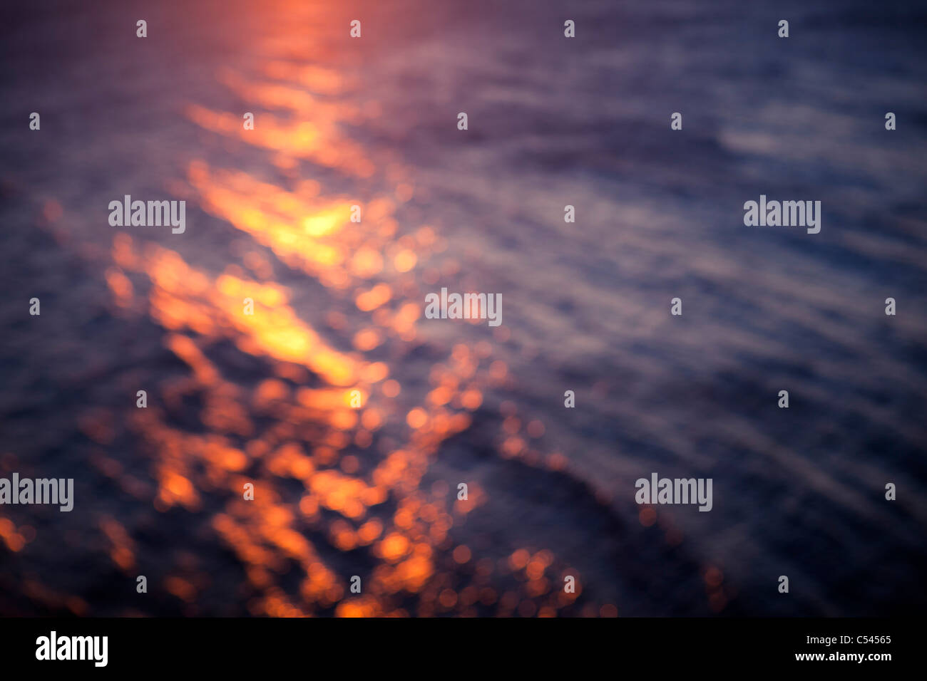 Water reflection of setting sun Stock Photo - Alamy