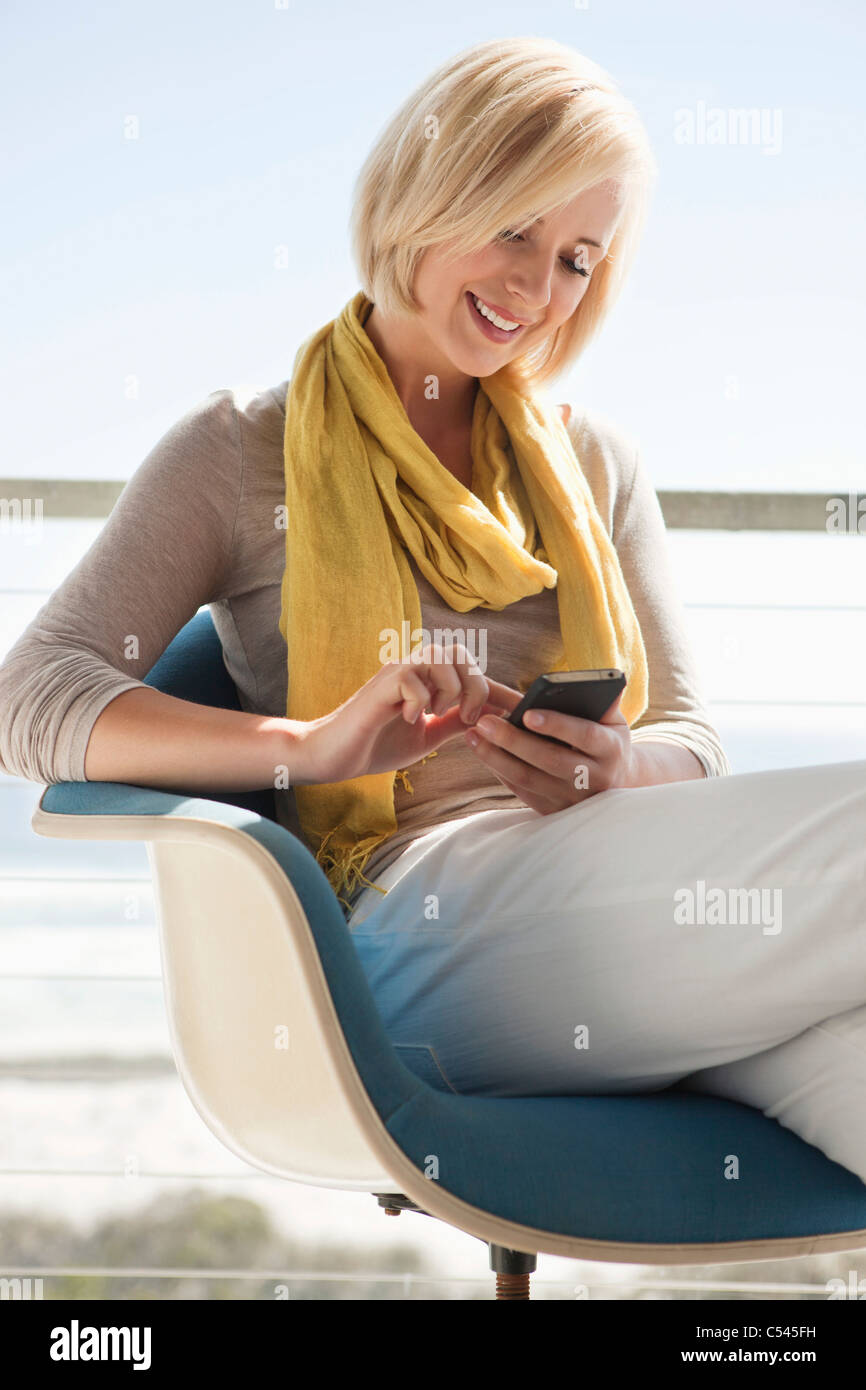 Woman text messaging on a mobile phone Stock Photo - Alamy