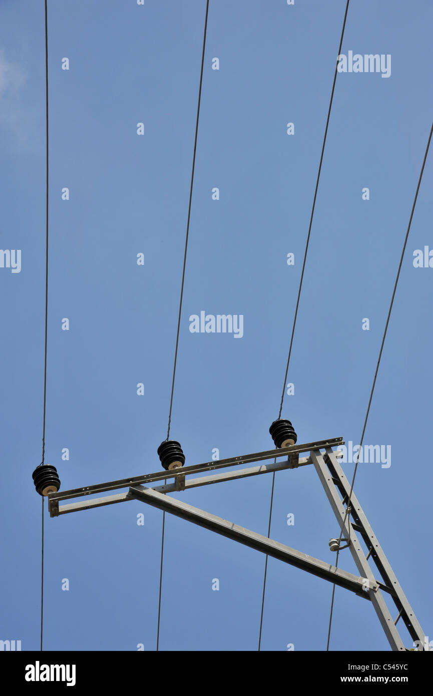 Electric line, electric pillar under clear blue sky Stock Photo - Alamy
