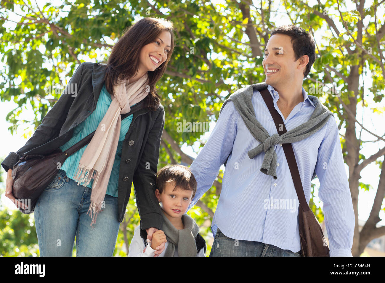 Family walking together on the road Stock Photo - Alamy