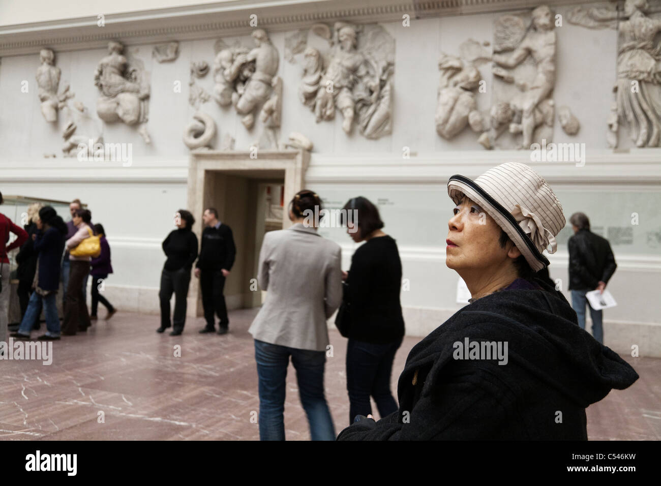 Asian tourist impressed inside the Pergamon Museum. Berlin, Germany ...