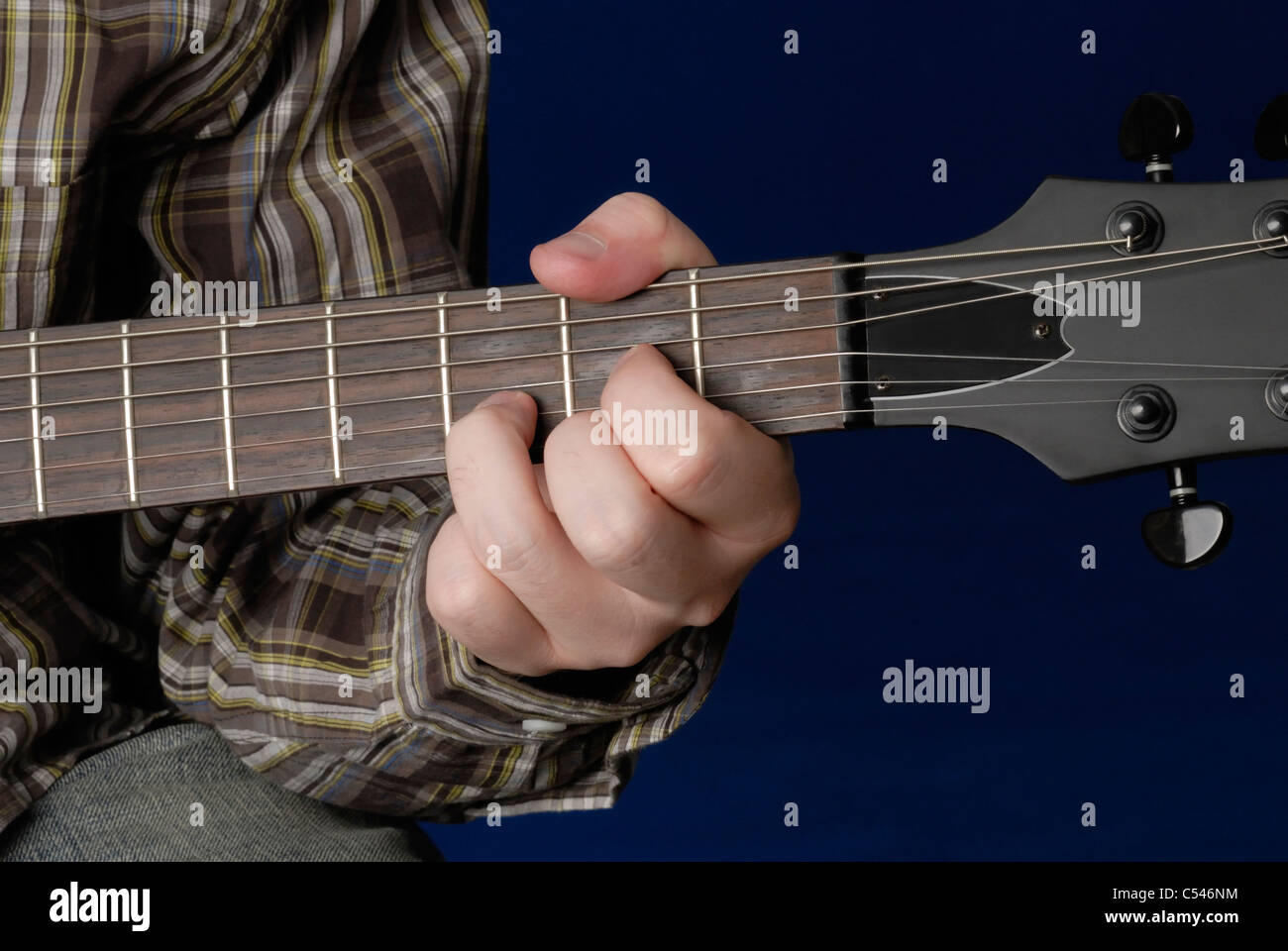 Man's hand demonstrating D chord on guitar Stock Photo - Alamy