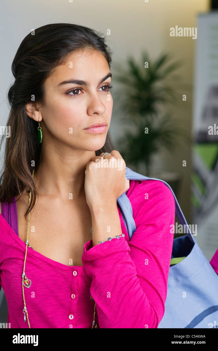 Close-up of a female university student looking away Stock Photo - Alamy