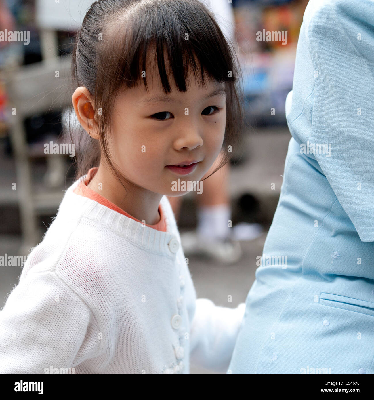 Close-up of a girl smiling, Shanghai, China Stock Photo - Alamy