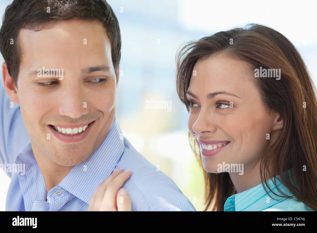Romantic couple smiling at each other Stock Photo - Alamy